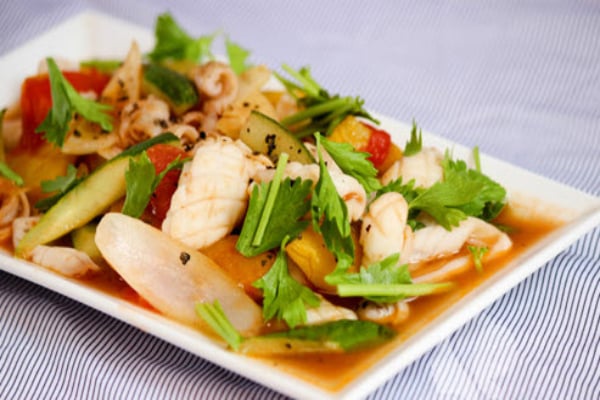 Indulge in a delectable squid stir-fry with fresh vegetables in just 30 ...