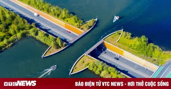 A mesmerizing fusion of water bridge and thoroughfare where boats and ...