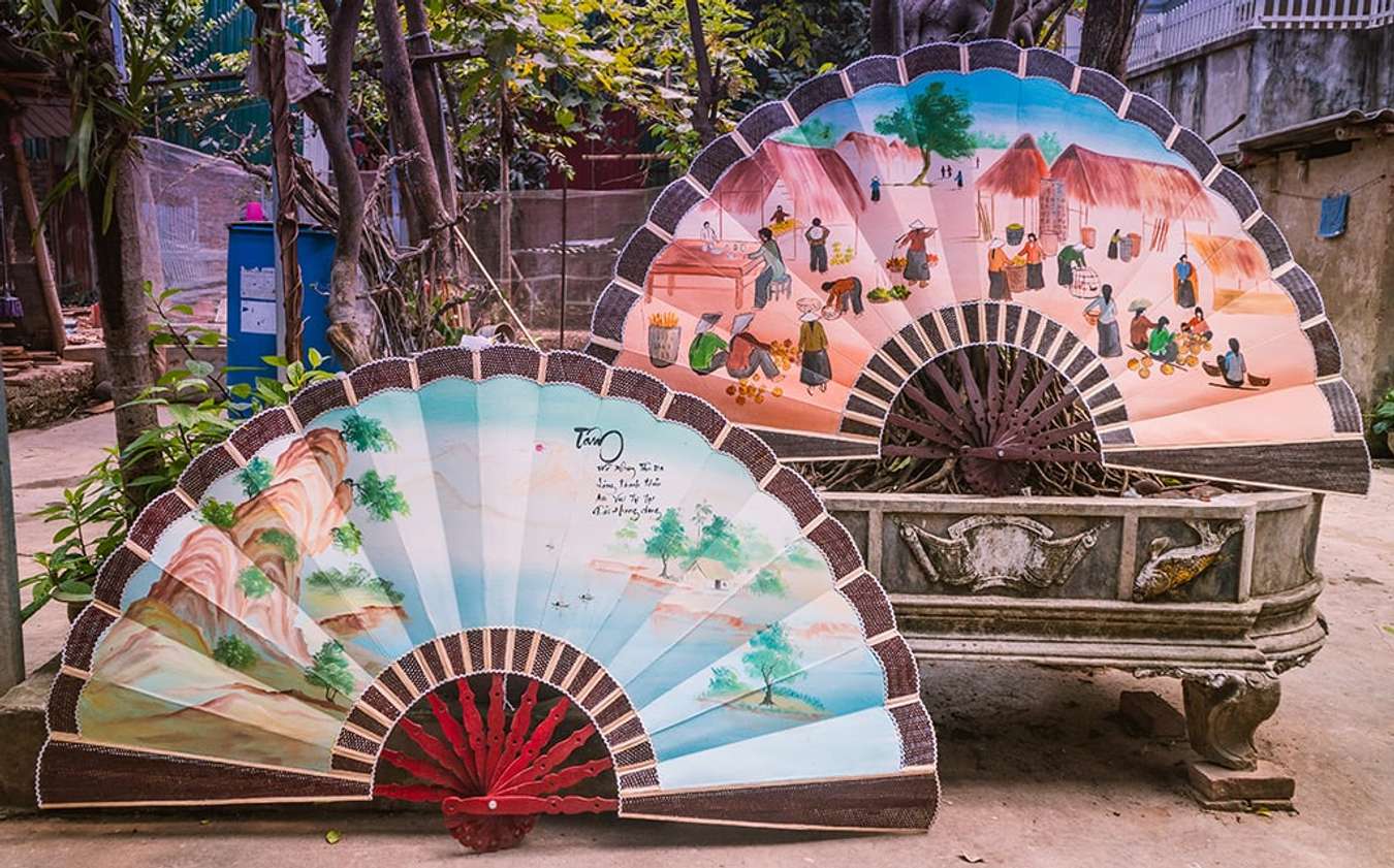 Visit Chàng Sơn Craft Village to explore the traditional fan-making craft.