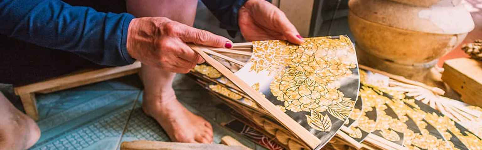 Visit Chàng Sơn Craft Village to explore the traditional fan-making craft.