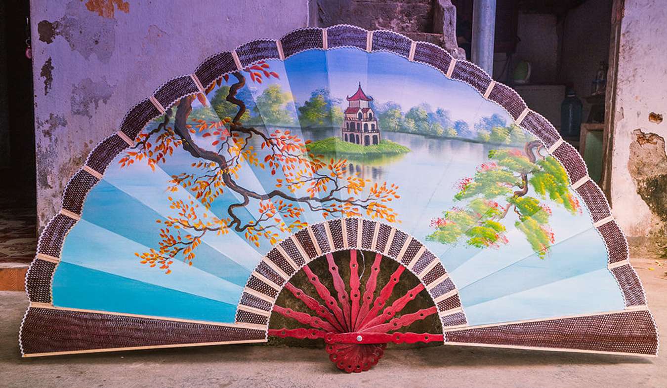 Visit Chàng Sơn Craft Village to explore the traditional fan-making craft.