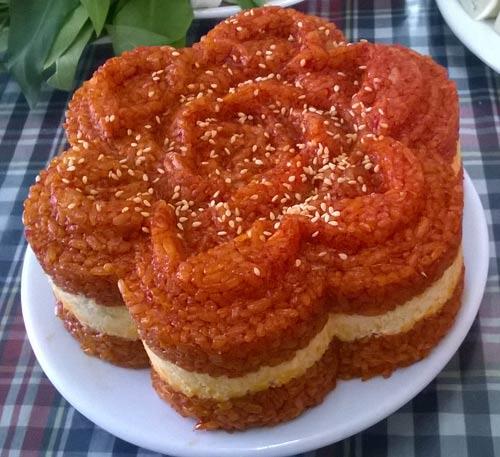 Discover the delicious way to make red gac sticky rice using a rice cooker