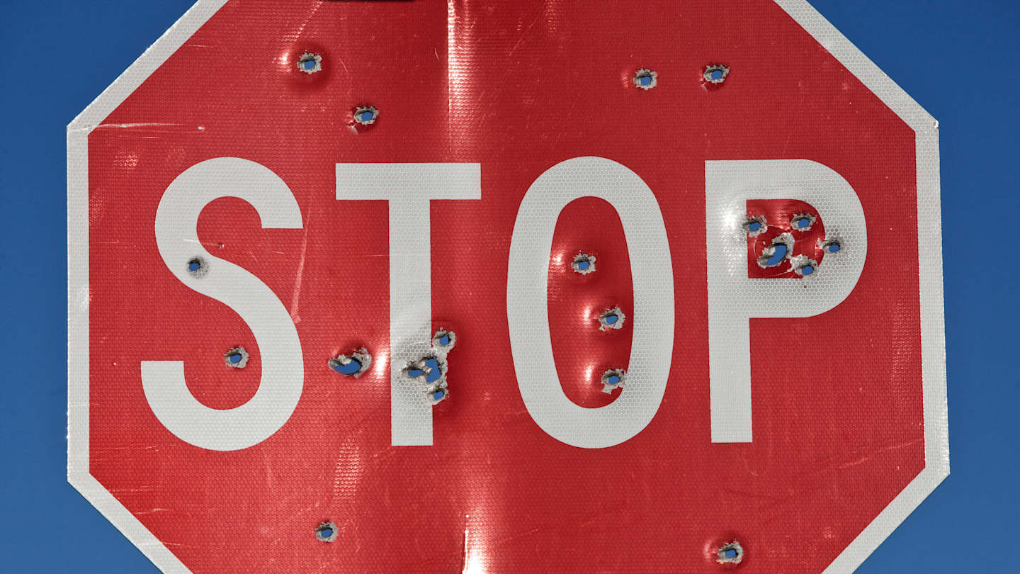 Why Are Some Road Signs Punctured with Holes?