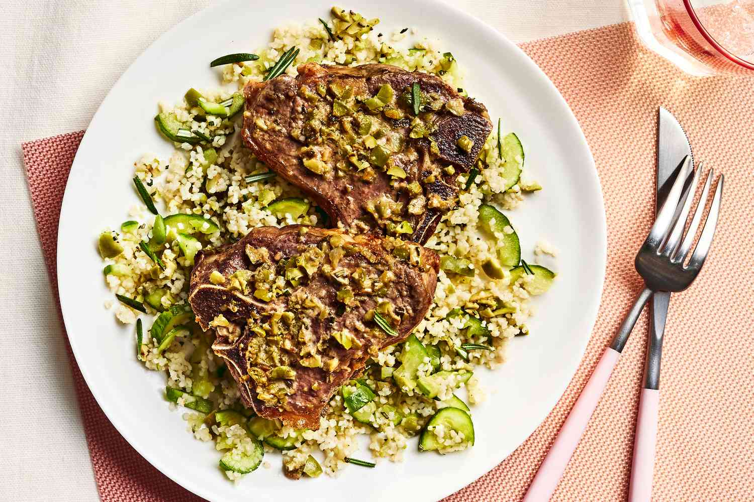 Rosemary-infused lamb chops with green olives, topped with a flavorful ...